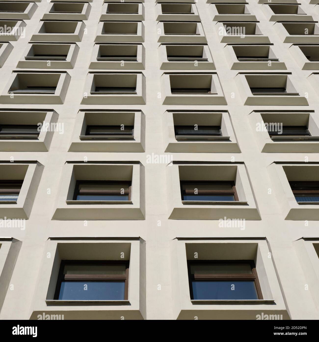 Identical convex windows of a concrete building. Uniform windows of a ...