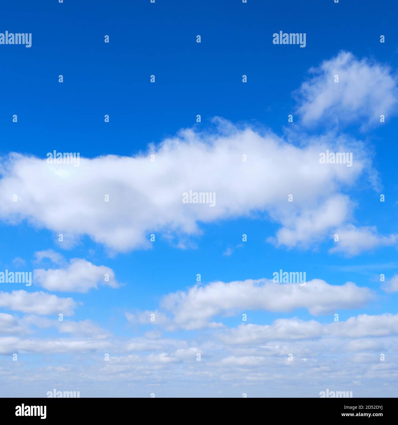 Spring blue sky with white fluffy clouds Stock Photo - Alamy