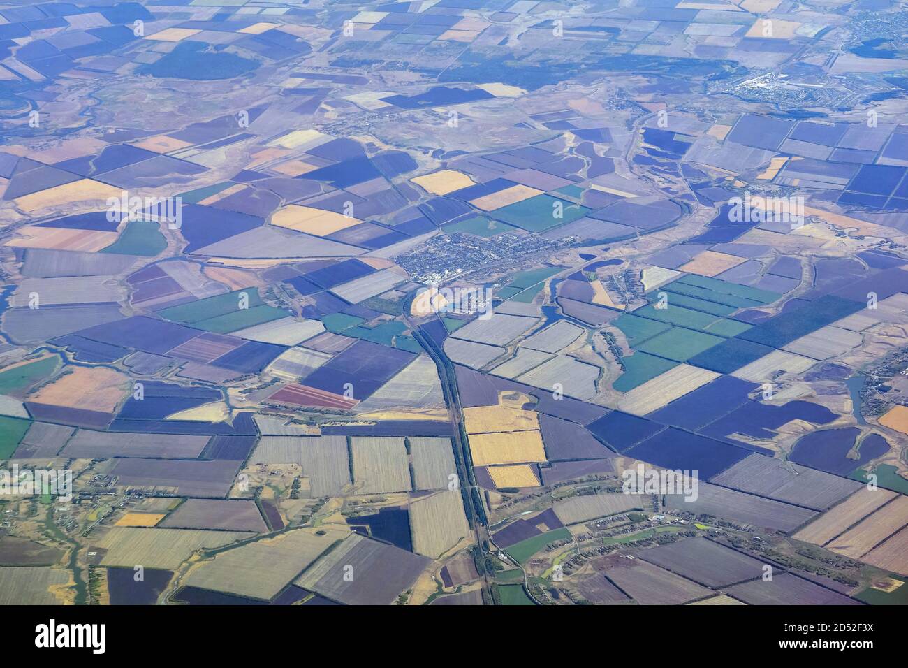aerial view of a densely populated region with multi-colored fields and ...