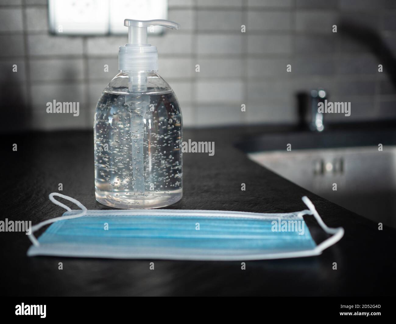 Hydroalcoholic gel for hand disinfection with mask in the kitchen Stock ...
