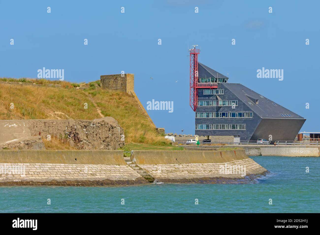 Old fortifications and modern office building in the harbor of Calais ...
