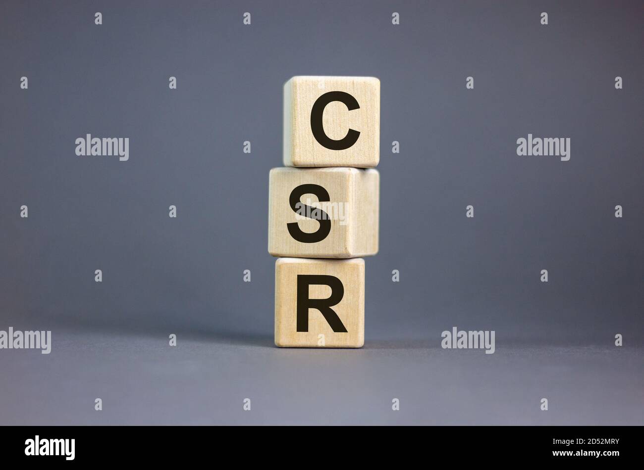 Concept words 'CSR, corporate social responsibility' on cubes on a ...