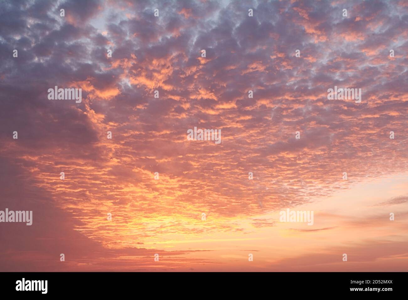 Sunset. Heaven, orange sky. Sun rays. Wallpaper. Clouds Stock Photo - Alamy