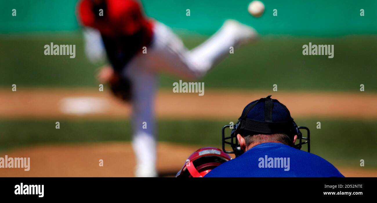 Baseball player wearing uniform throwing baseball Stock Photo - Alamy