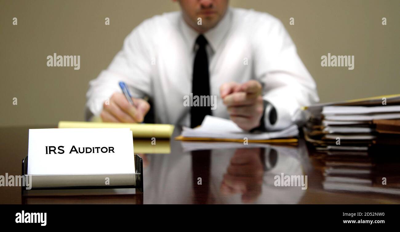 IRS tax auditor man with a stern or mean expression Stock Photo - Alamy