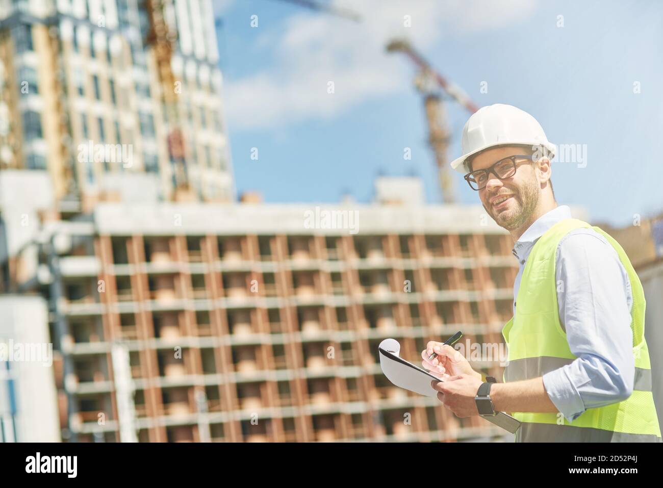 Architect wearing work helmet writing hi-res stock photography and ...