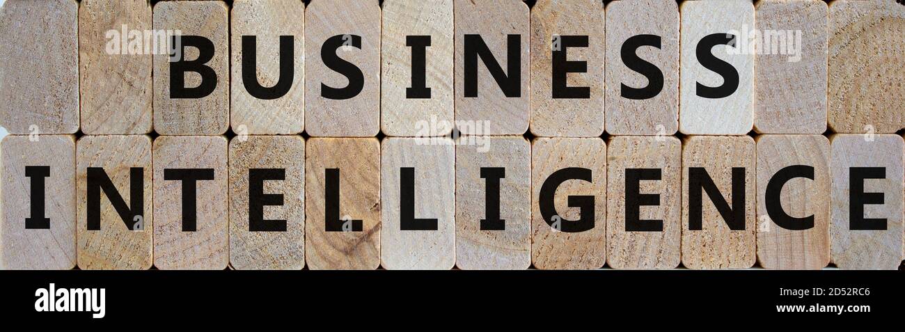Wooden blocks form the words 'business intelligence'. Beautiful wooden ...