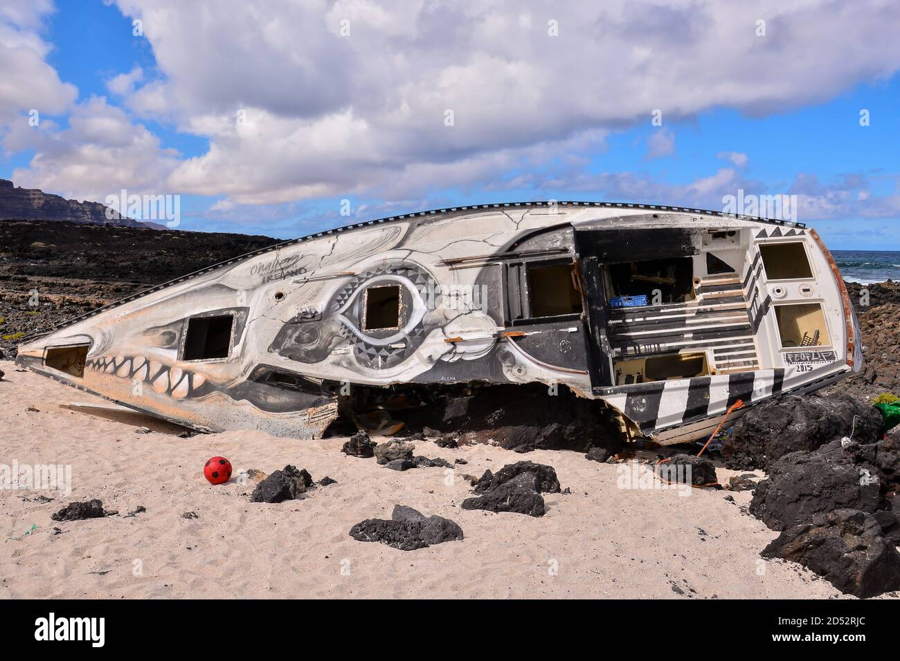 Sailboat stranded on the beach after a storm Stock Photo - Alamy