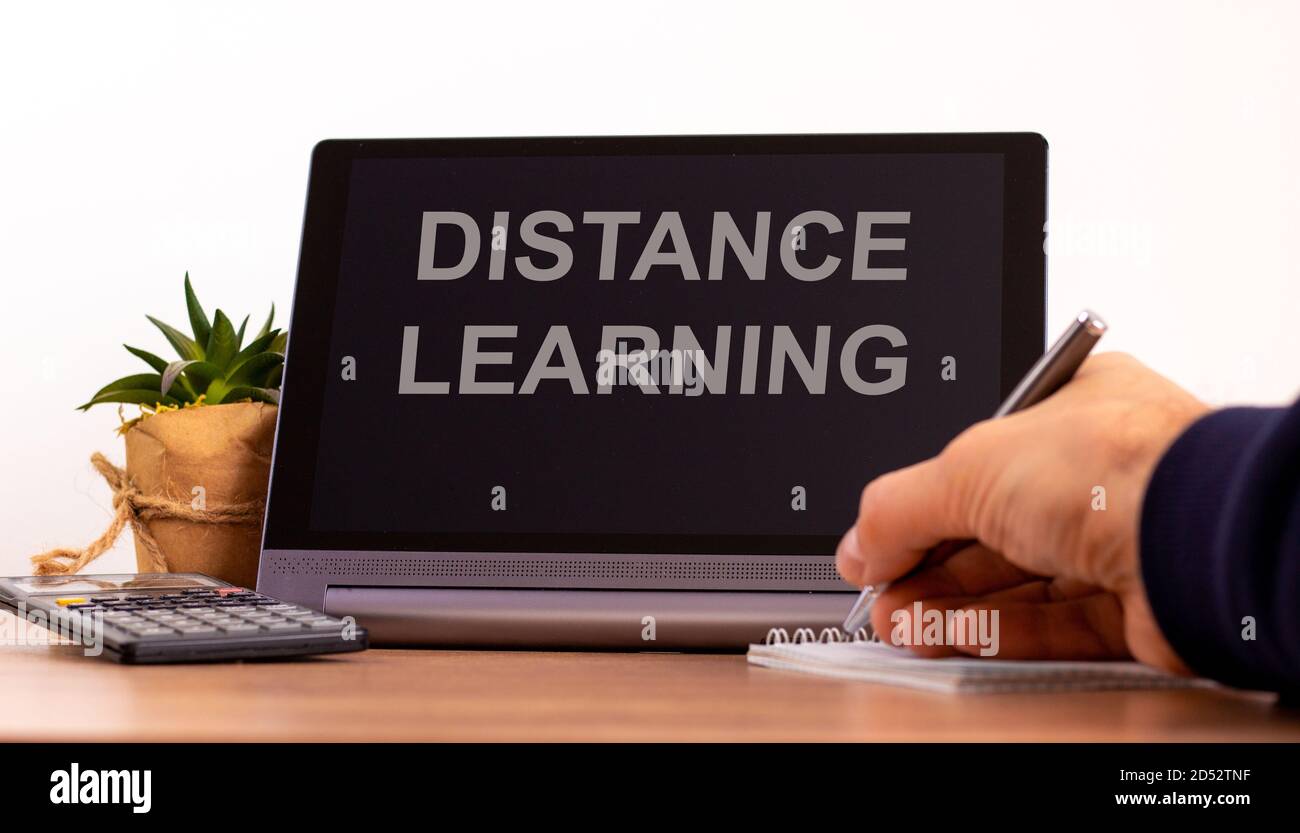 Education concept. Tablet with text 'distance learning'. Online ...