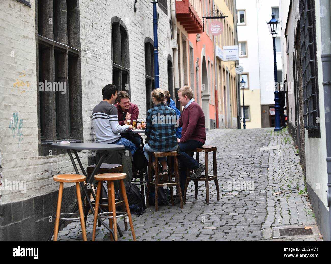 Cologne, Germany, 2020. The old town of Cologne drinkers sitting ...