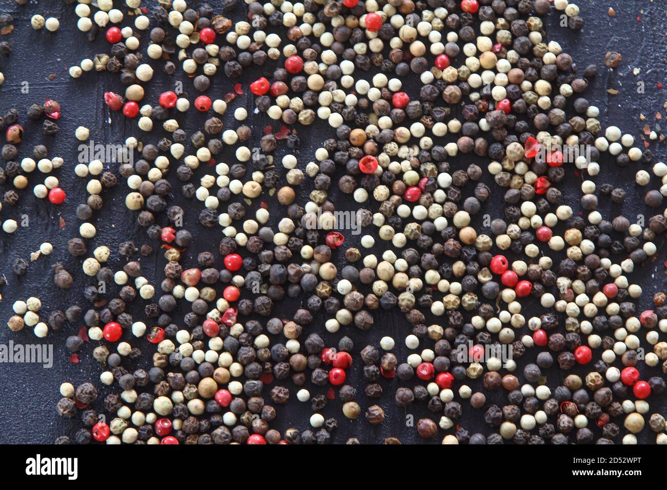 A mixture of peppers. Black, white, red polka dots. Isolated on a white ...