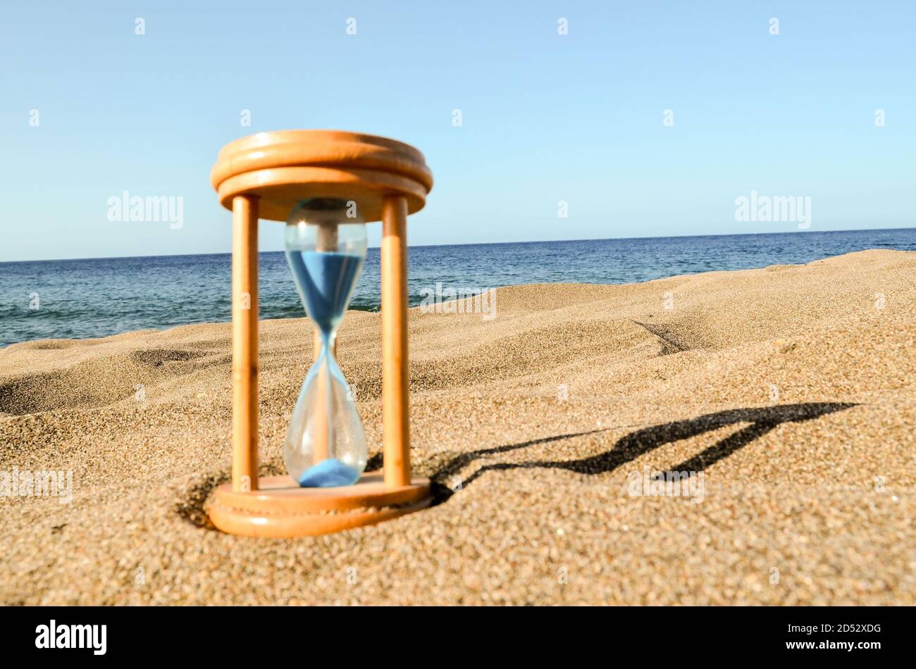 Hourglass Clock on the Sand Beach Stock Photo - Alamy