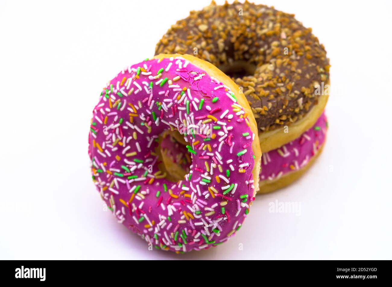 chocolate and berry doughnut, walnut donut on a white background, pink ...