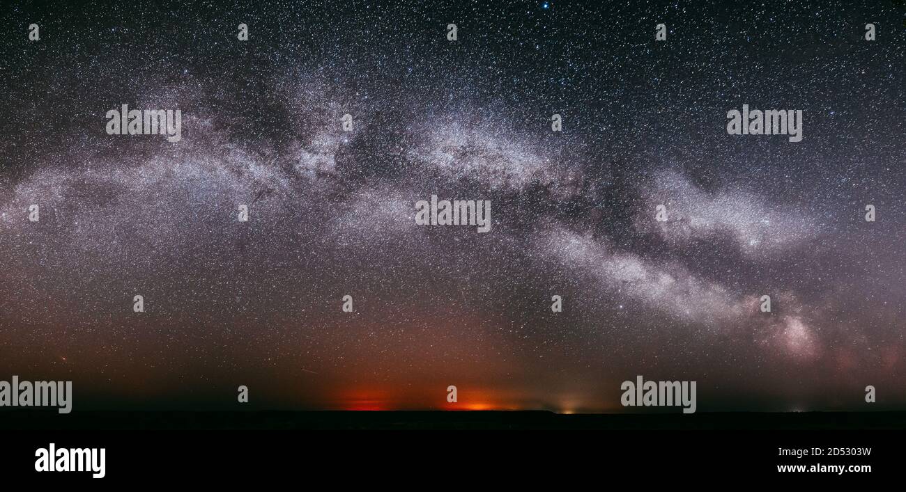 Night Starry Sky With Glowing Stars Above Landscape With City Lights ...