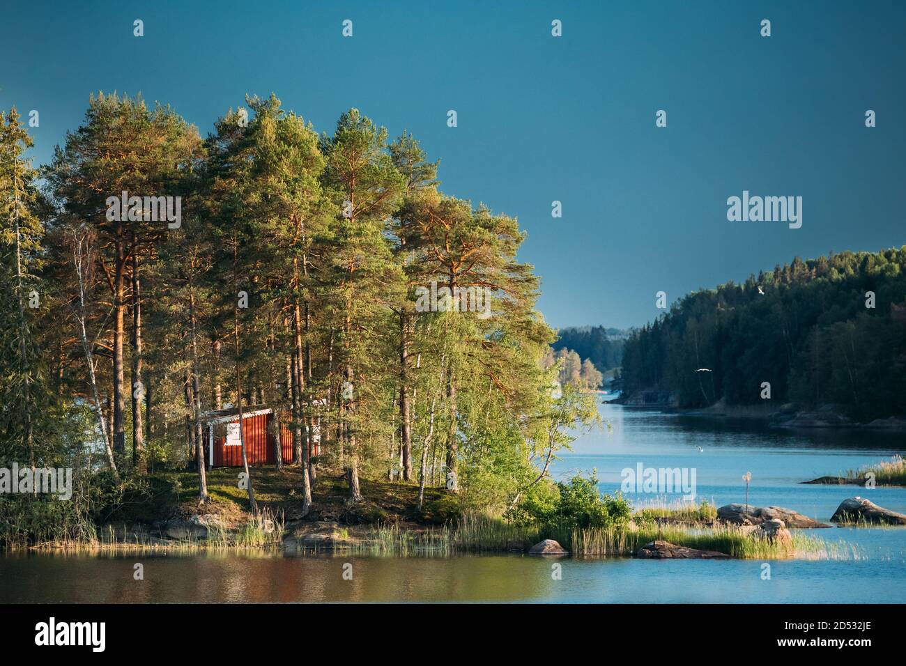 Sweden. Beautiful Red Swedish Wooden Log Cabin House On Rocky Island ...