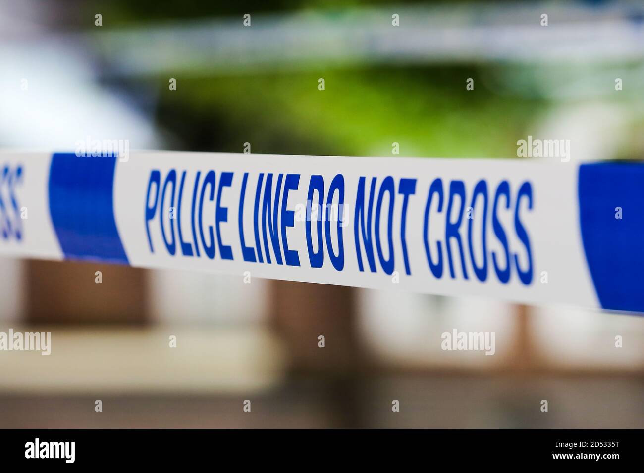 Police tape seen around the crime scene in London Stock Photo - Alamy