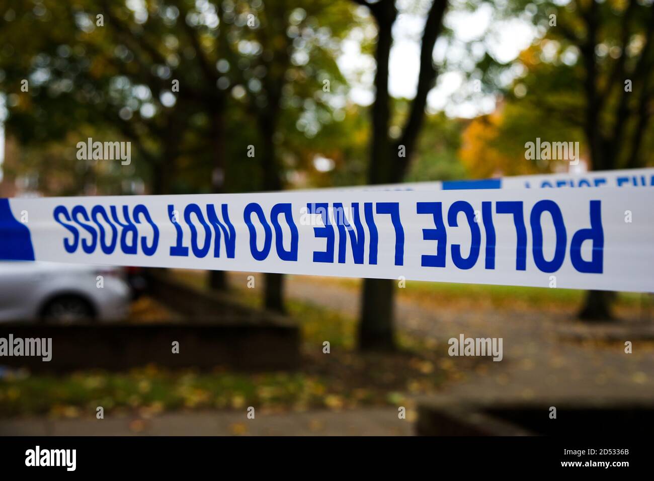 Police tape seen around the crime scene in London Stock Photo - Alamy