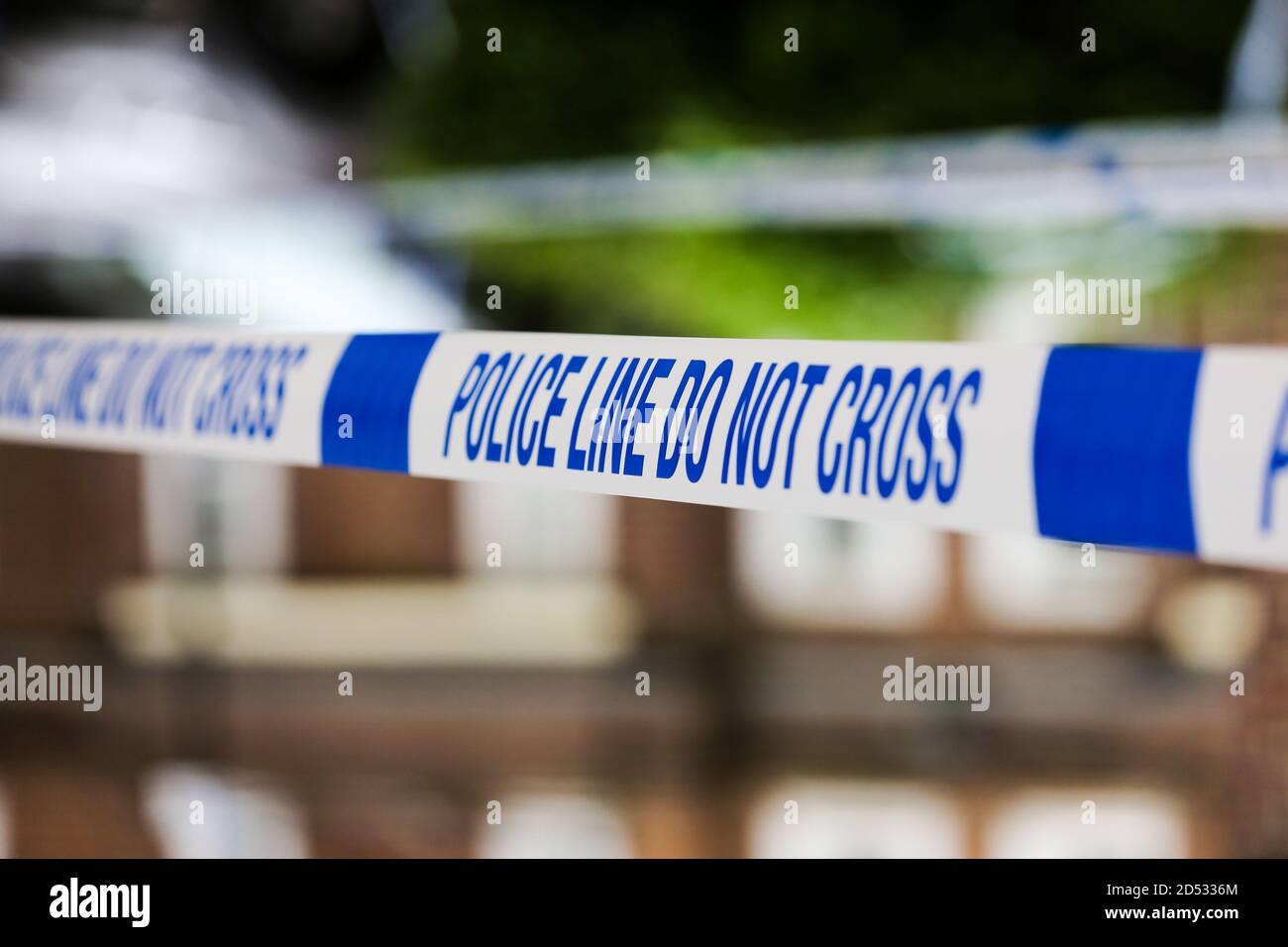 Police tape seen around the crime scene in London Stock Photo - Alamy