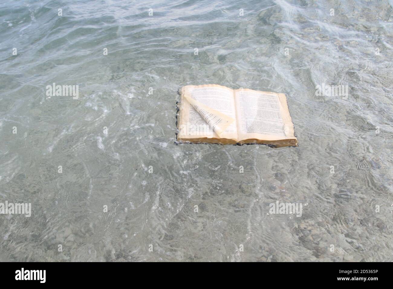 open book floating on water Stock Photo - Alamy