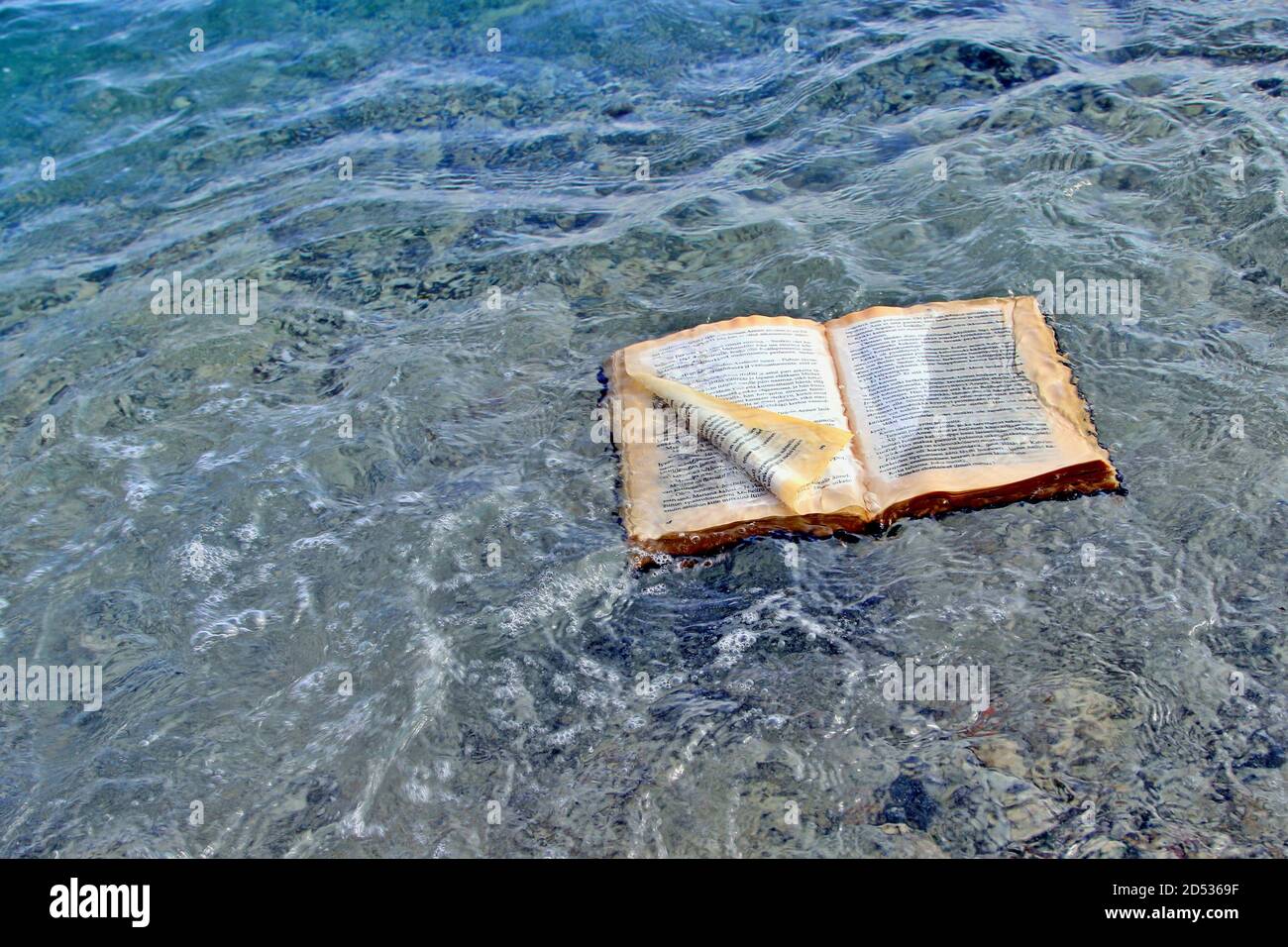 open book floating on water Stock Photo - Alamy