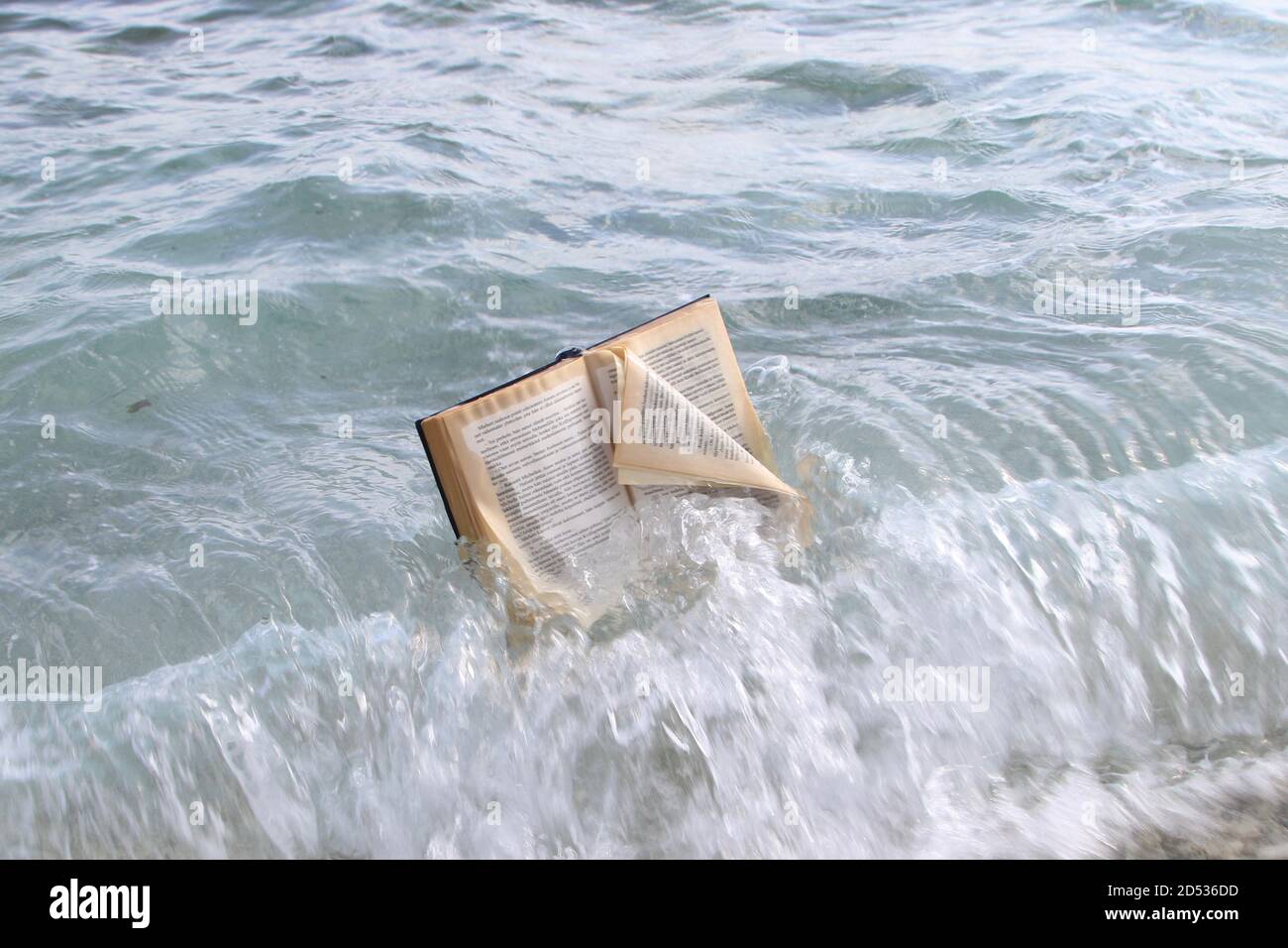 open book floating on water Stock Photo - Alamy