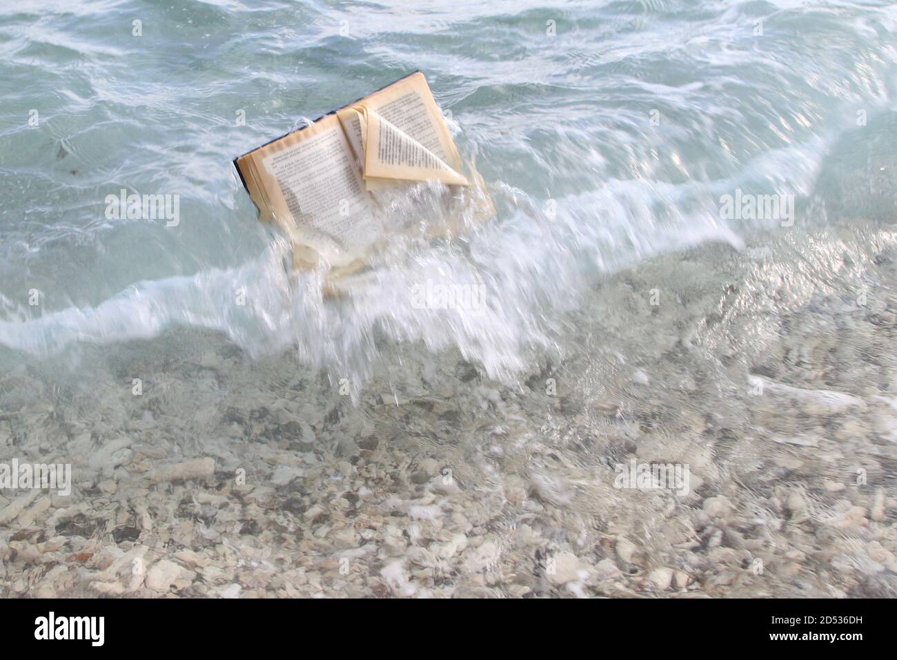 open book floating on water Stock Photo - Alamy