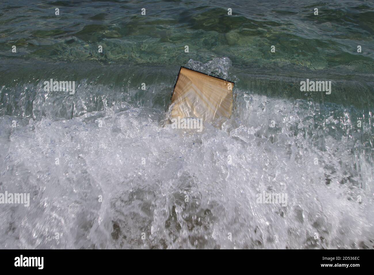 open book floating on water Stock Photo - Alamy