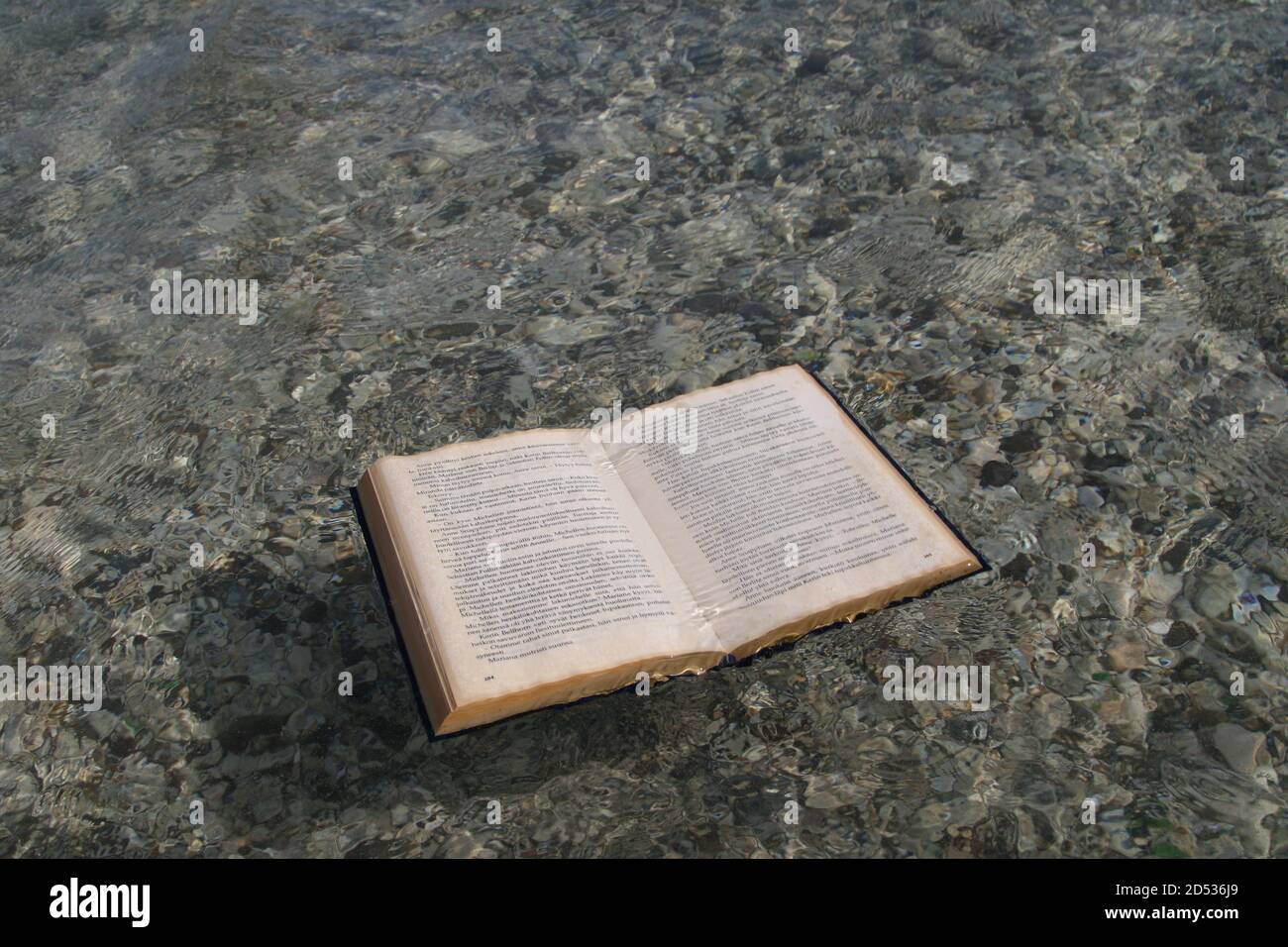 open book floating on water Stock Photo - Alamy