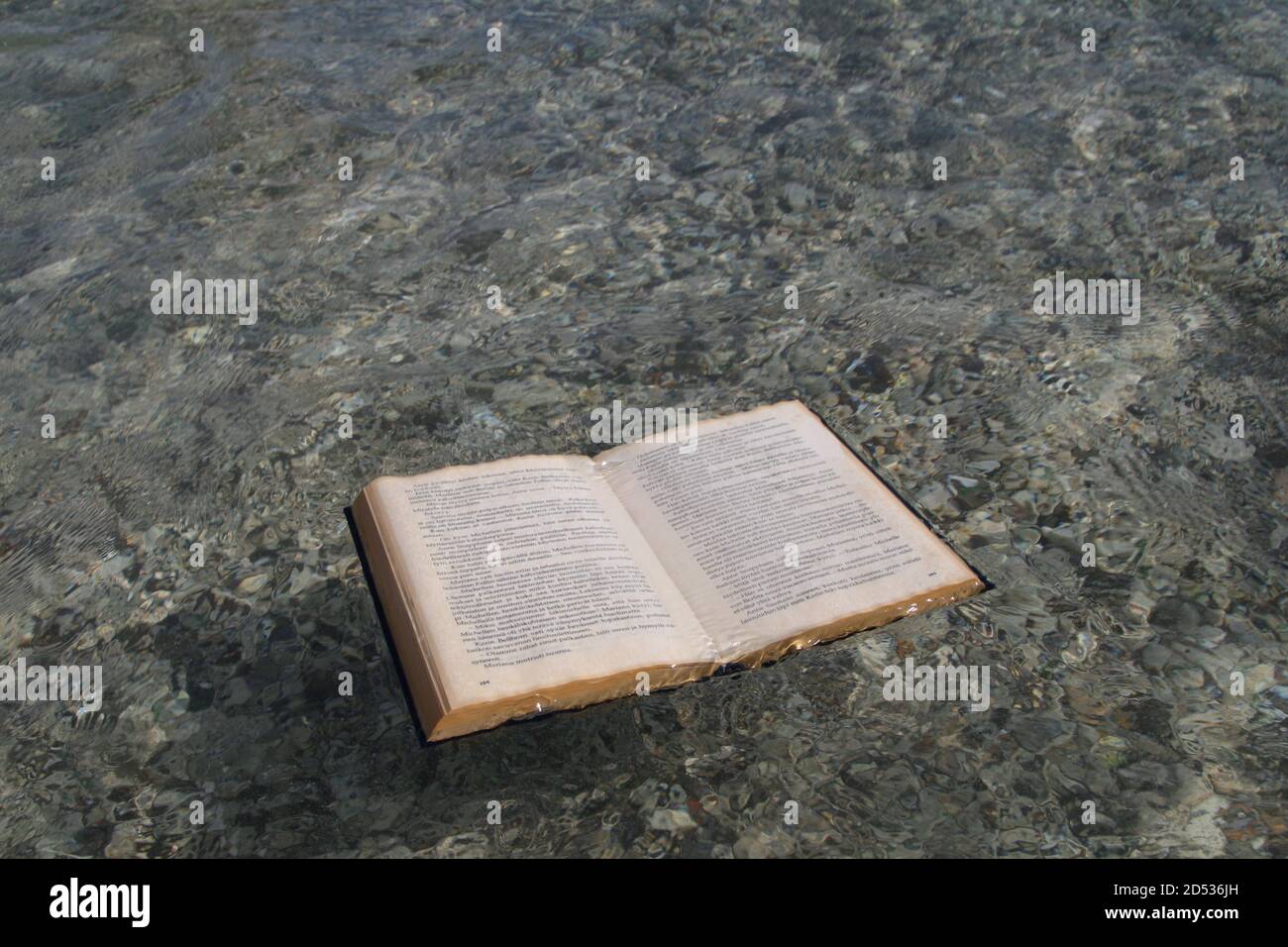 open book floating on water Stock Photo - Alamy