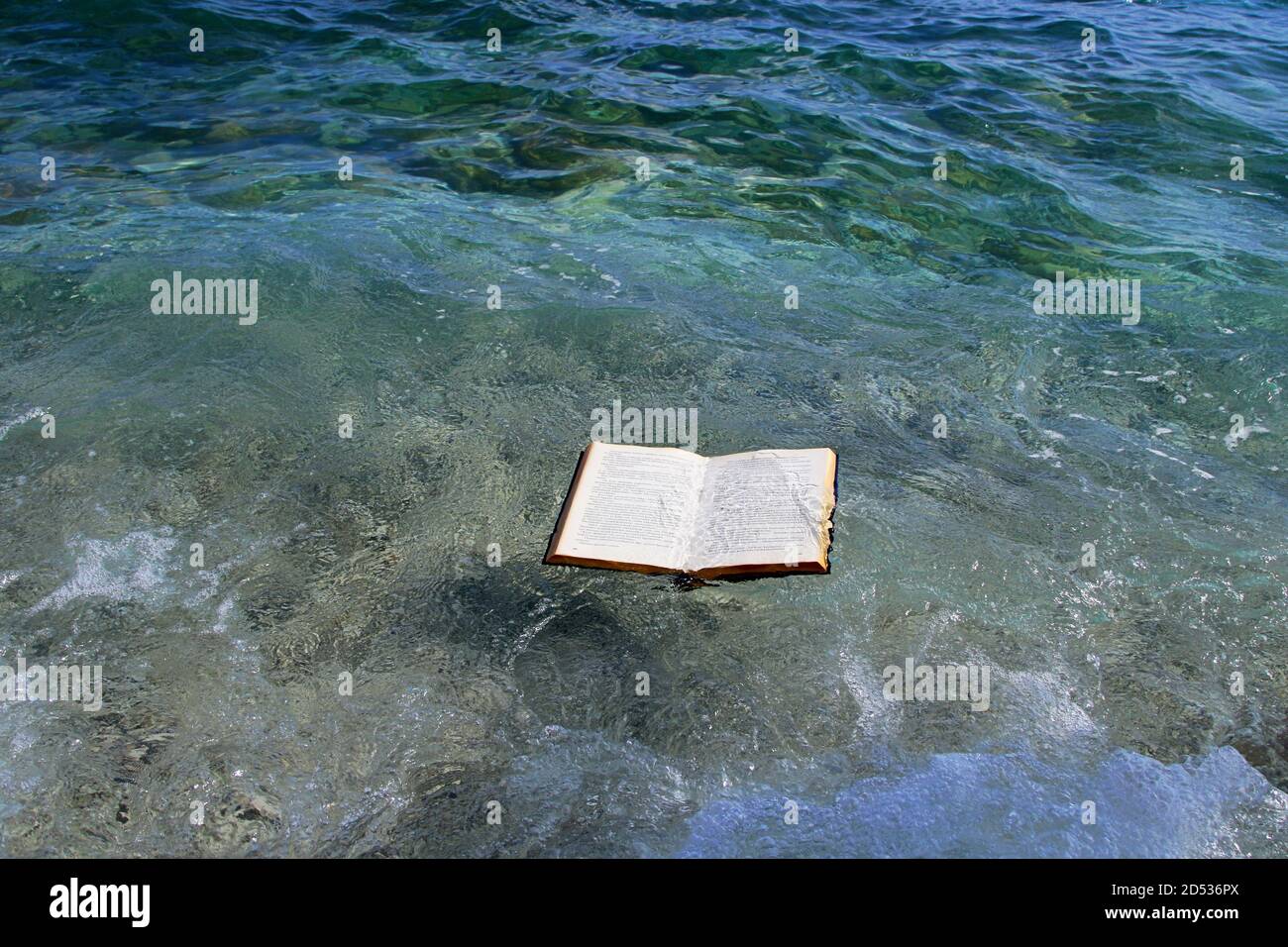 open book floating on water Stock Photo - Alamy