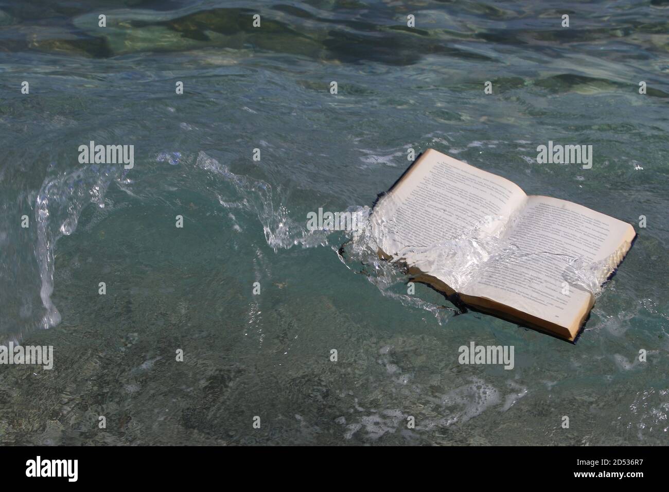 open book floating on water Stock Photo - Alamy