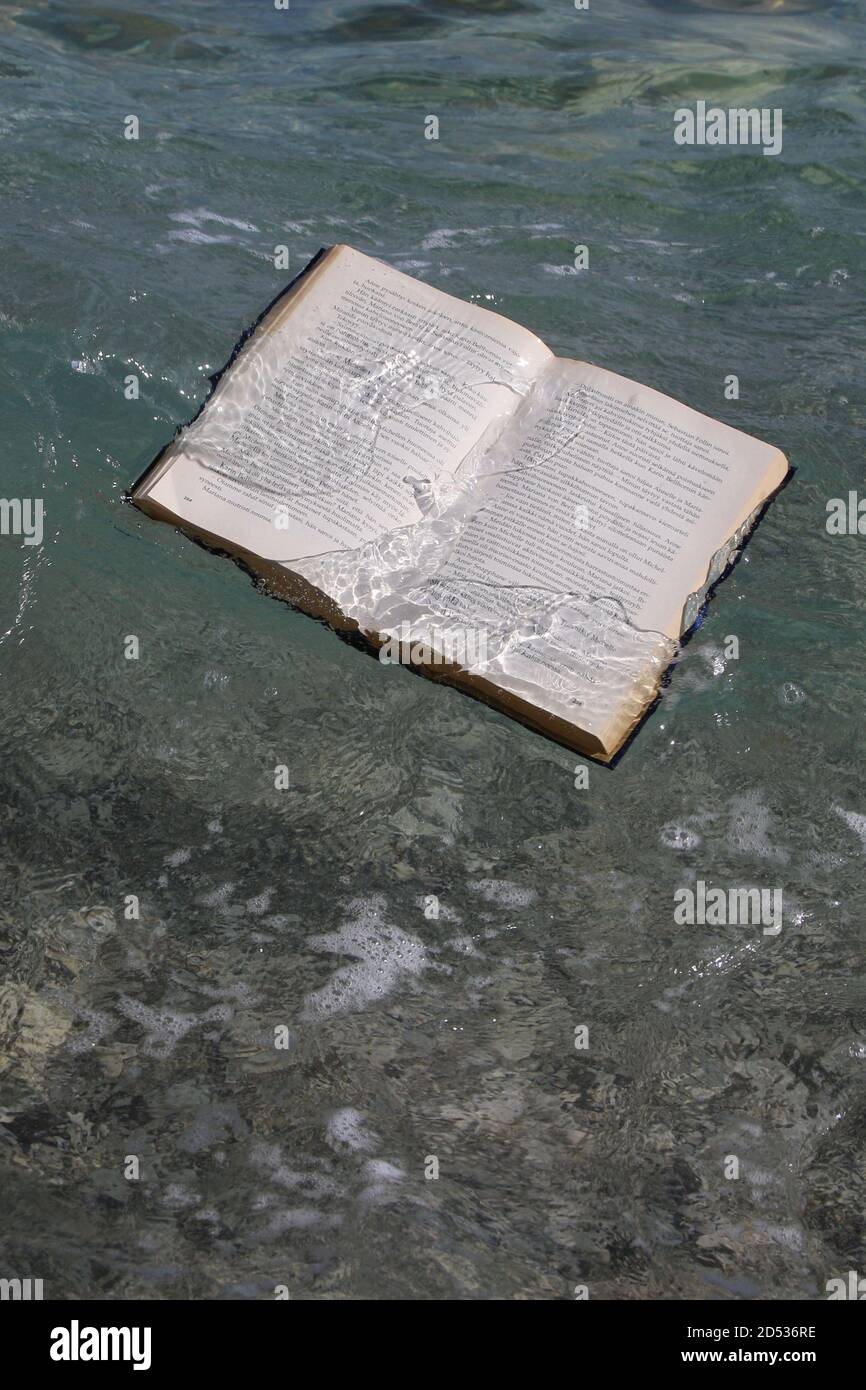 open book floating on water Stock Photo - Alamy