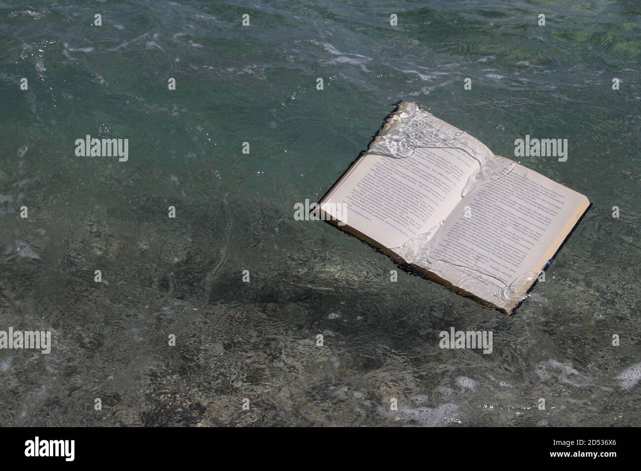 open book floating on water Stock Photo - Alamy