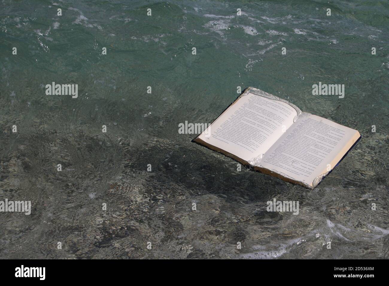 open book floating on water Stock Photo - Alamy