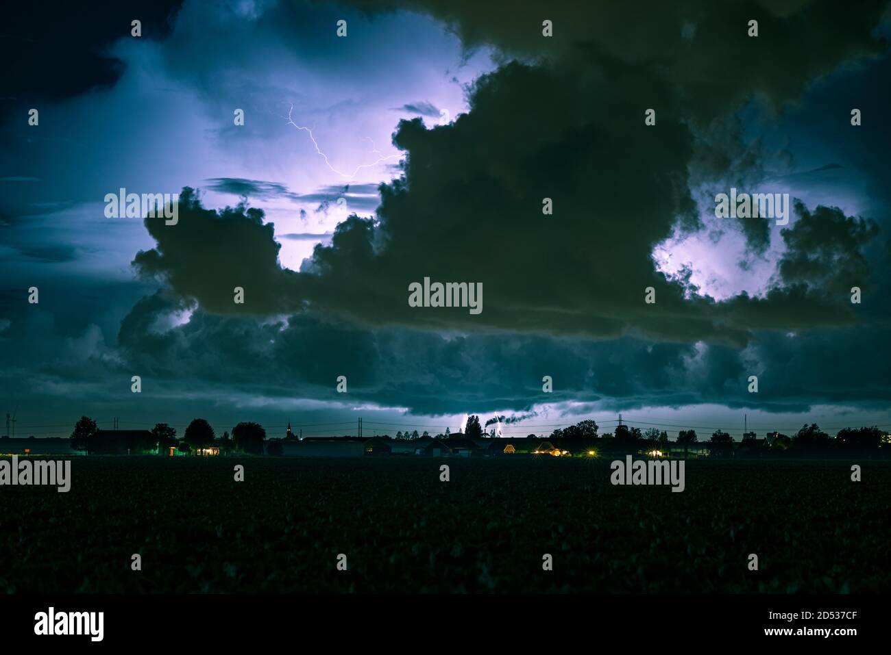 Storm clouds at night with distant lightning strikes Stock Photo - Alamy