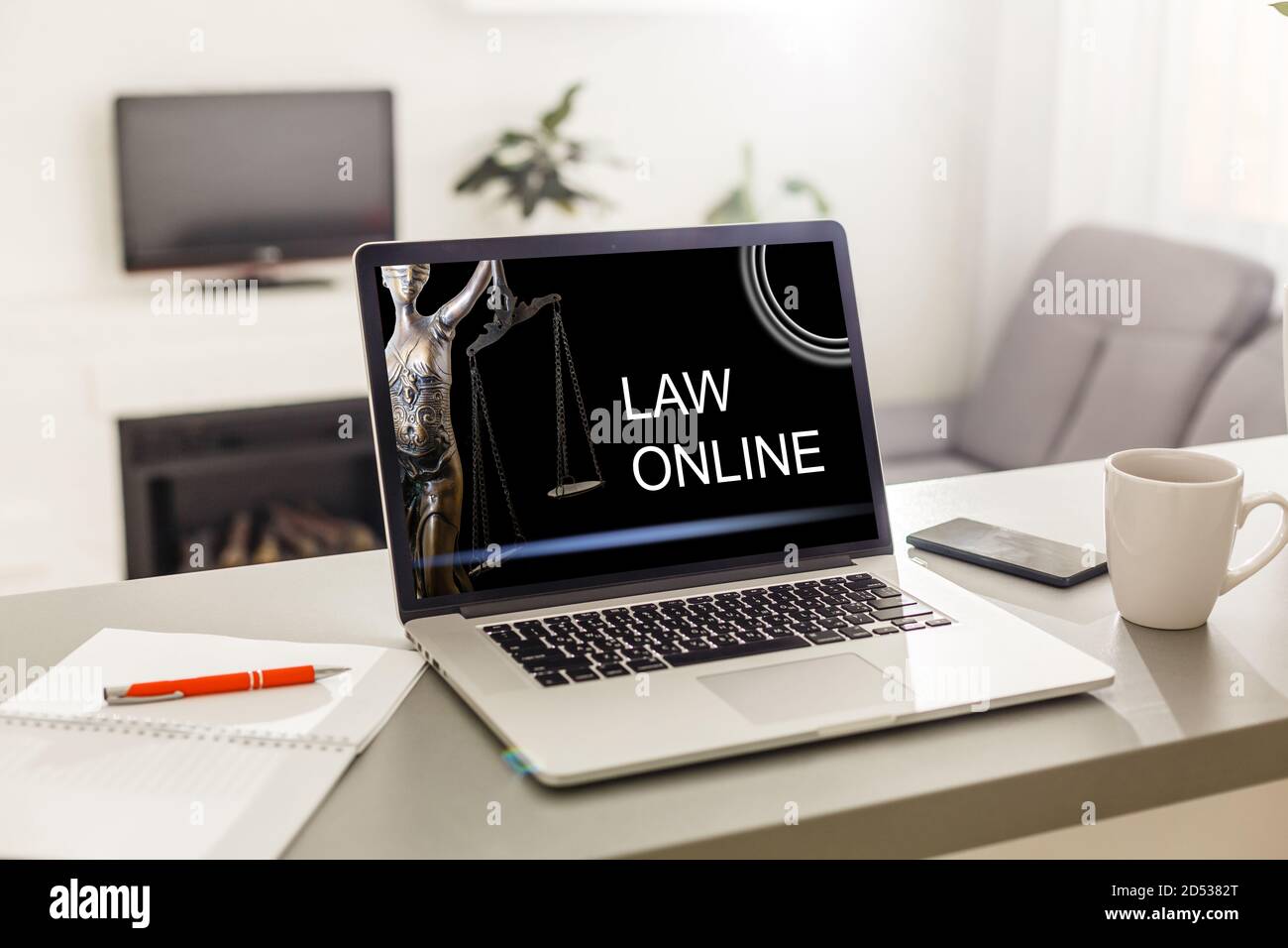 Law icon with modern laptop computer on wooden table over office ...