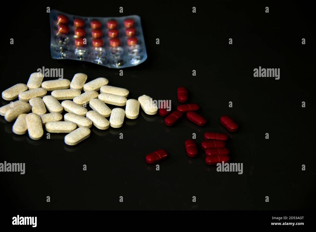 Black and red capsules hi-res stock photography and images - Alamy