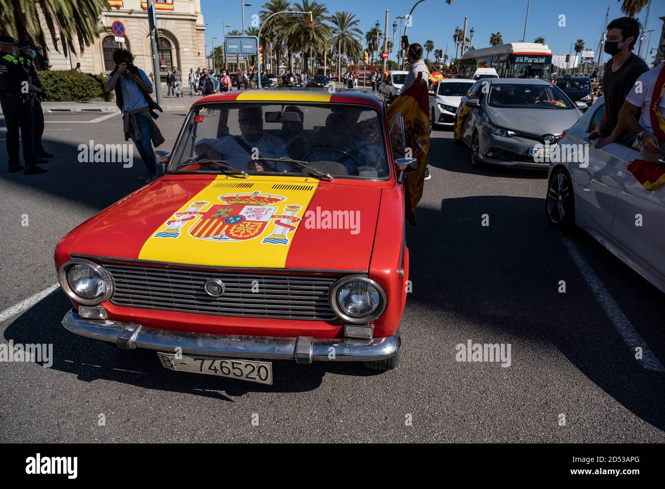 A car with the bodywork painted in the colors of the Spanish flag is ...