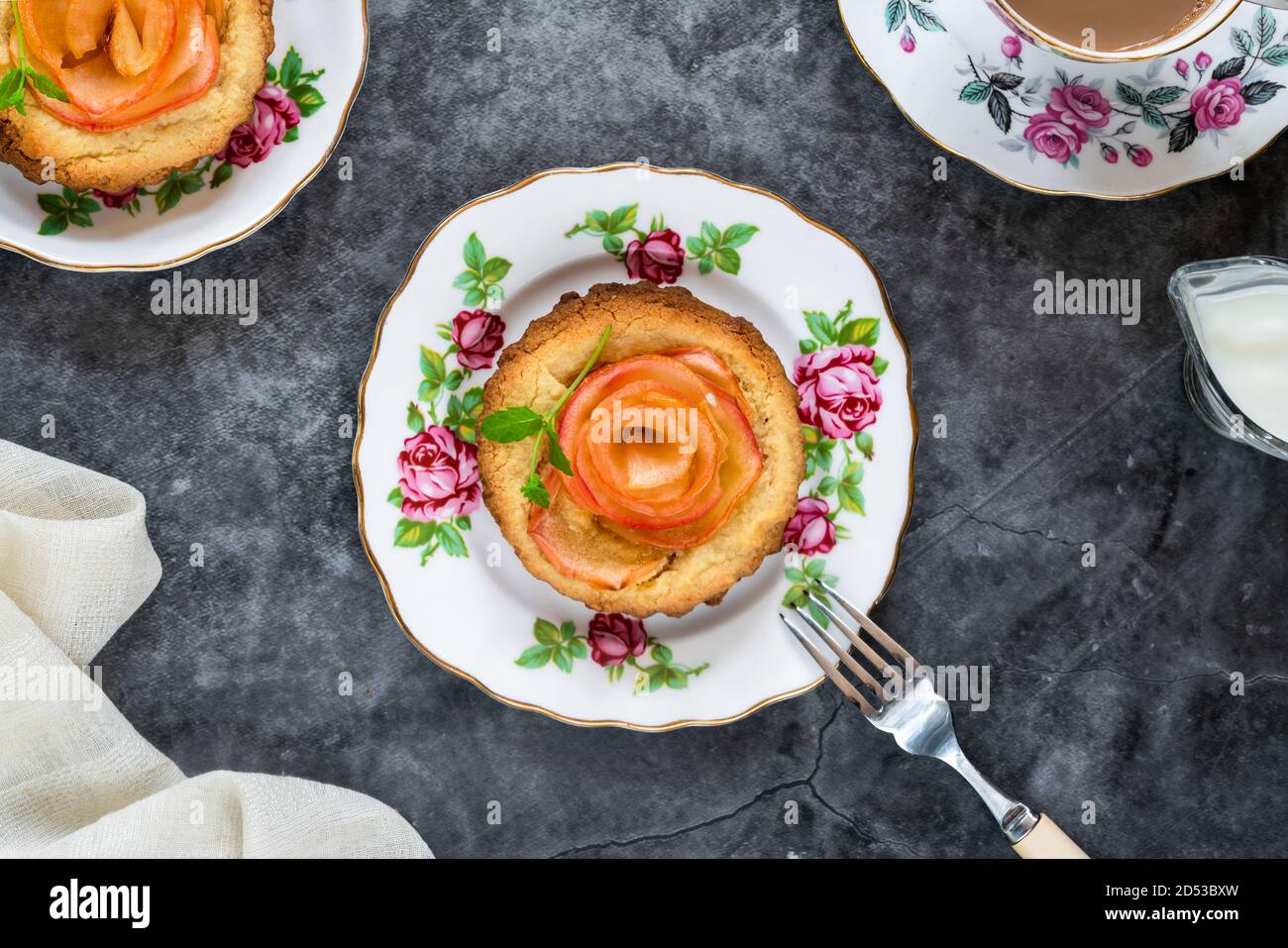 Mini almond tarts with apple slices arranged into a rose Stock Photo ...