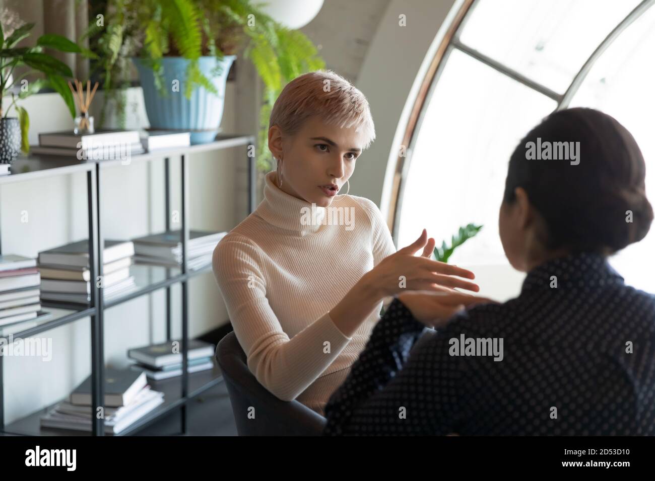Multiethnic female colleagues coworking in hi-res stock photography and ...