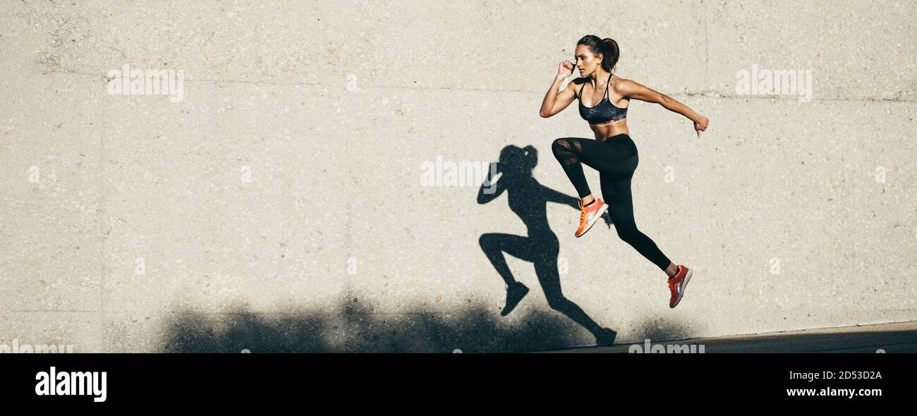 fitness female model doing cardio exercise in morning. Panorama ...
