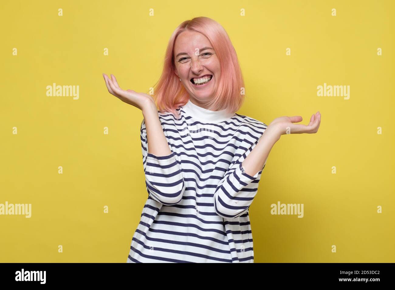 Woman with joyful expression, cheers and celebrates her success Stock ...