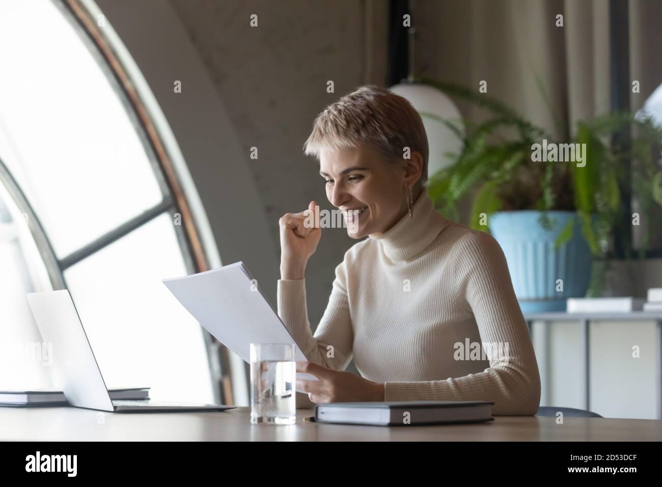Successful lady reading good news hi-res stock photography and images ...