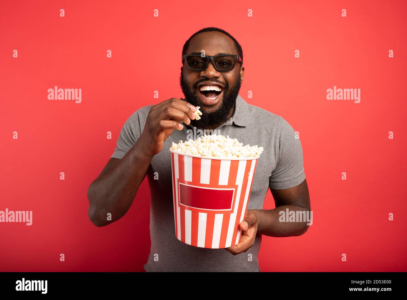 Boy has fun watching a film. Concept of entertainment and streaming tv ...