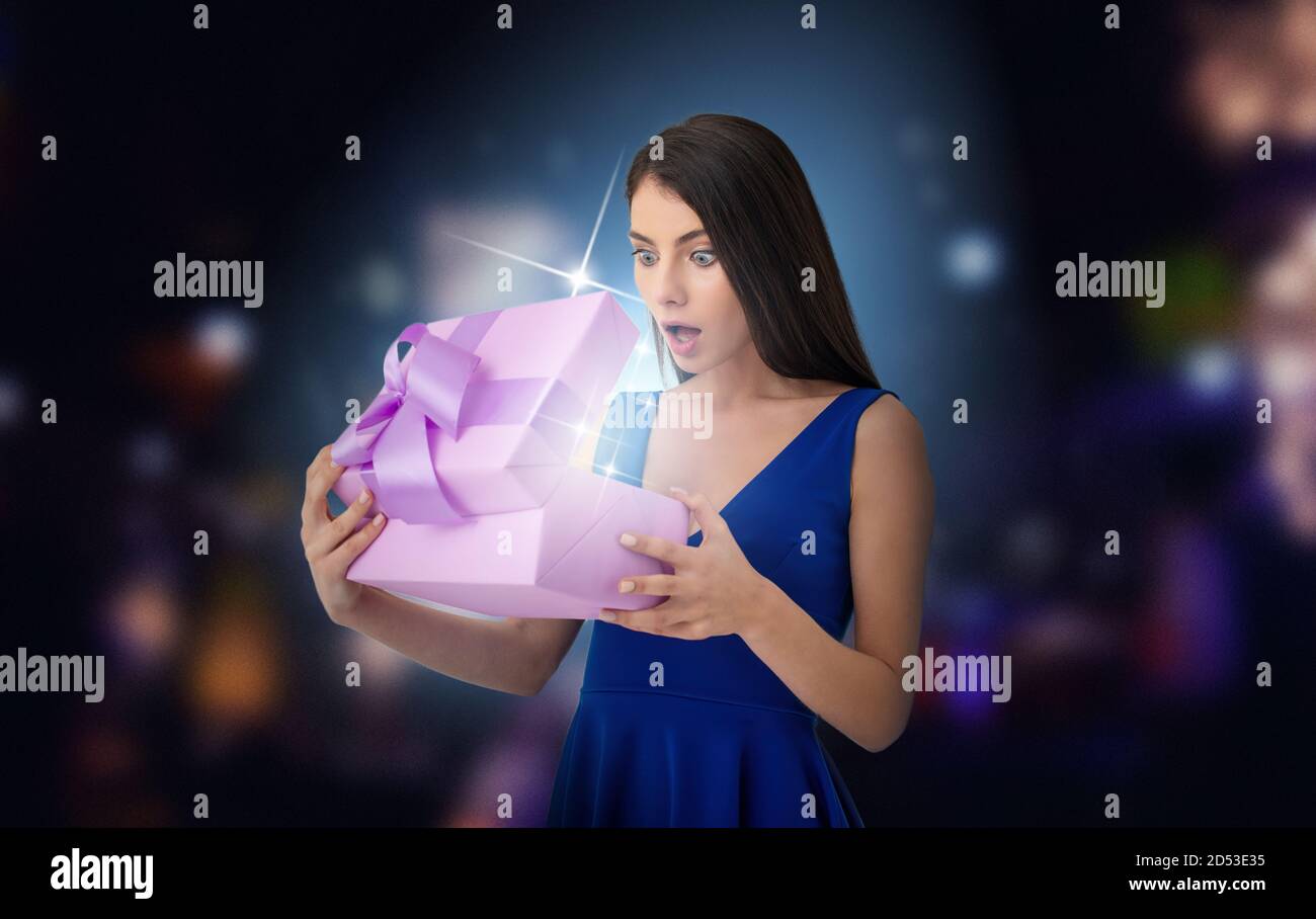 Woman is shocked because she received a good gift Stock Photo - Alamy