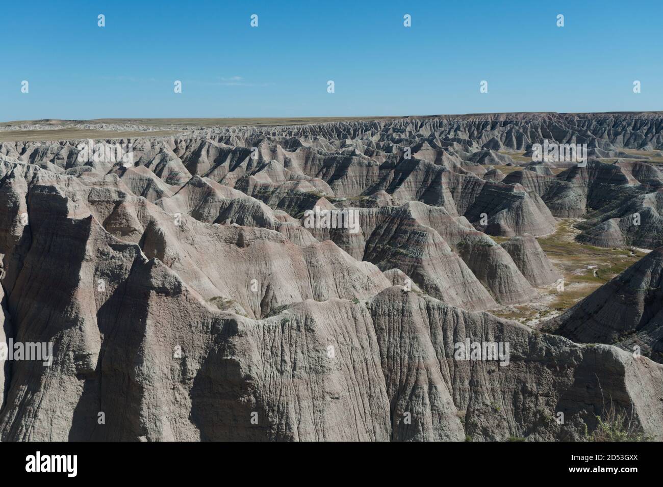 Layered Rock formations, steep Canyons and towering Spires of Badlands ...