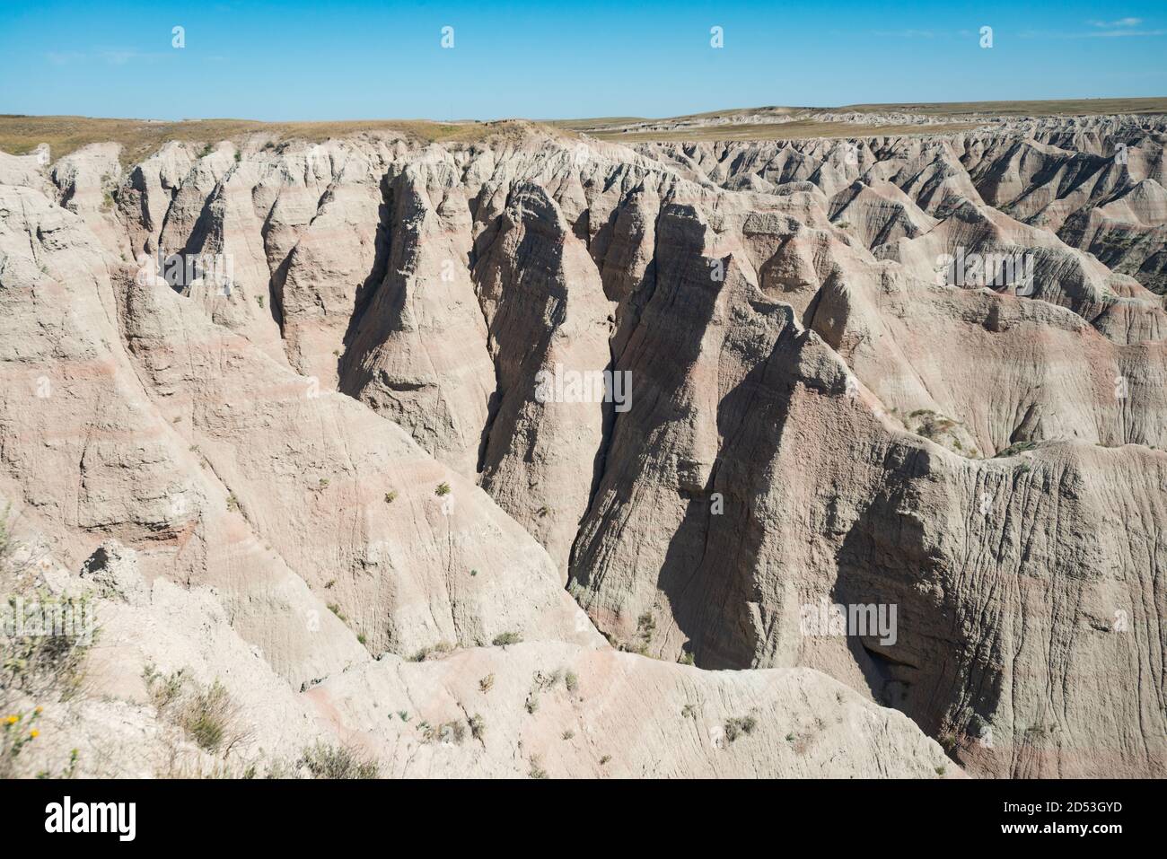 Layered Rock formations, steep Canyons and towering Spires of Badlands ...