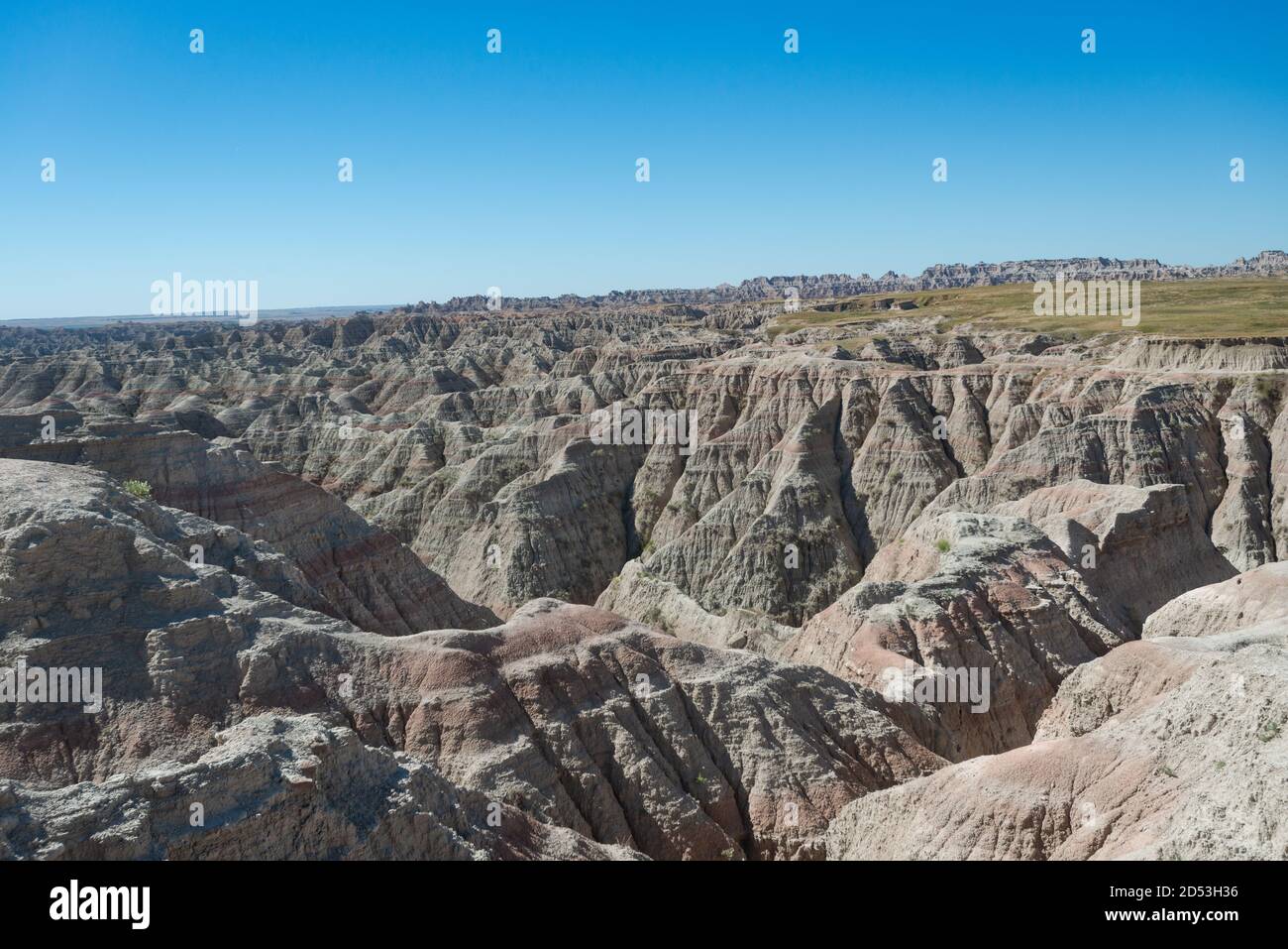 Layered Rock formations, steep Canyons and towering Spires of Badlands ...