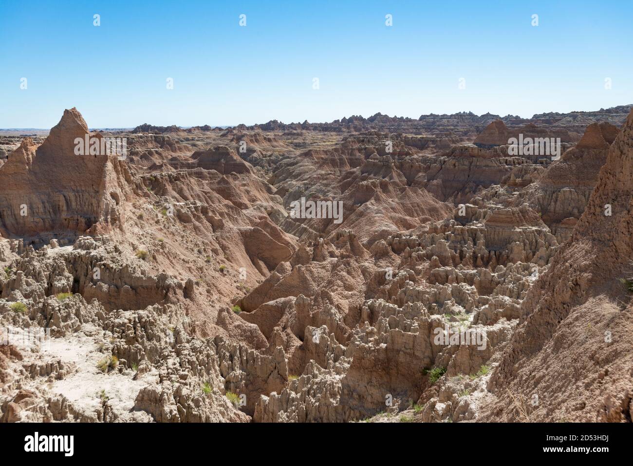 Layered Rock formations, steep Canyons and towering Spires of Badlands ...