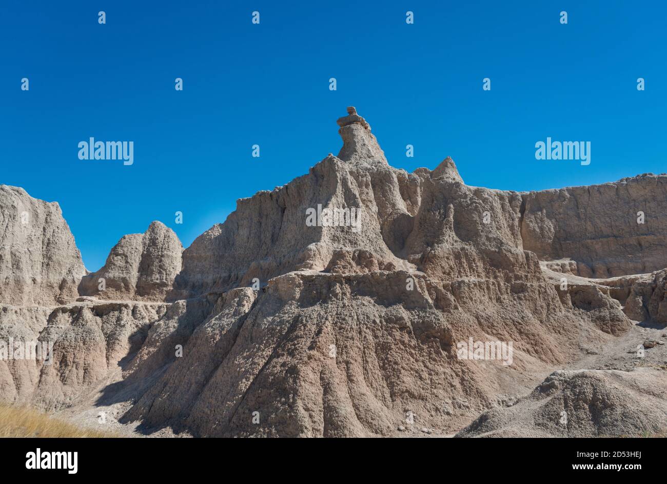 Layered Rock formations, steep Canyons and towering Spires of Badlands ...